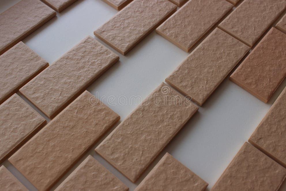 Missing Areas on Surface Covered in Even Rows of Wall Tiles with ...