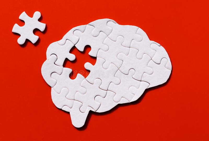 Missing Puzzle Piece beside Brain-Shaped Puzzle on Red Stock Photo ...