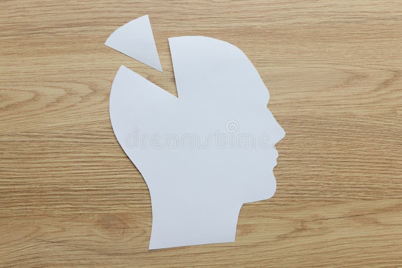 Missing Triangular Piece of Paper Head Shape on Wooden Table Stock ...