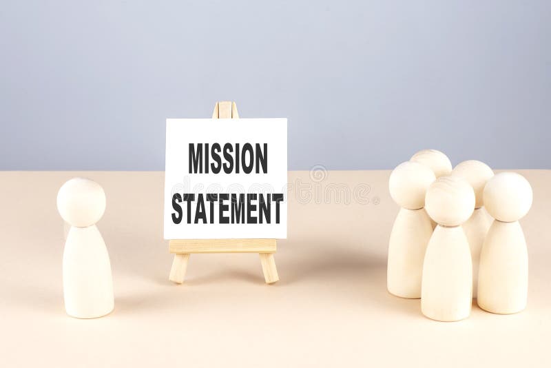MISSION STATEMENT Text on Easel with Wooden Figure, Meeting Concept ...