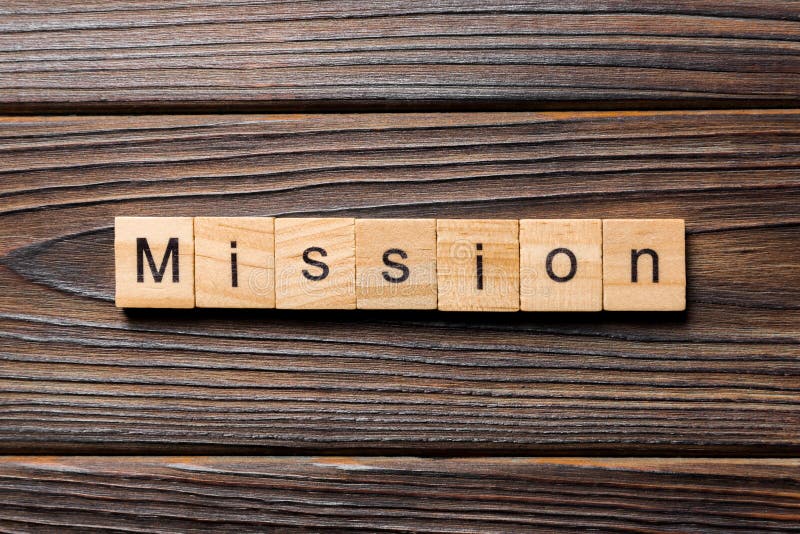 MISSION Word Written on Wood Block. MISSION Text on Table, Concept ...