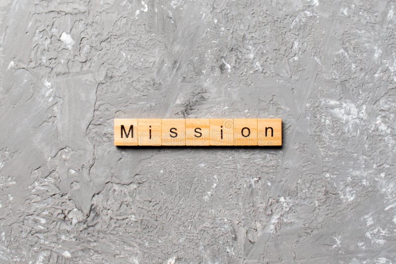 Our Mission on Word Written on Wood Block. Our Mission Text on Table ...