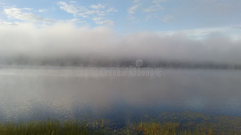 A mist above the lake. stock photo. Image of outdoors - 97528314