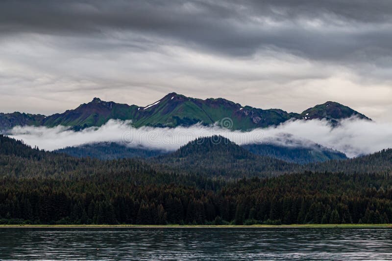 Mist between the Mountains of Alaska in Summer Stock Image - Image of ...