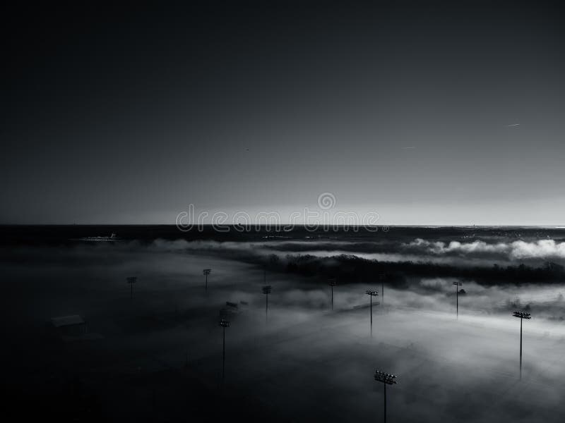 Mist Rises Over an Athletic Field at Dawn from Overhead Stock Image ...