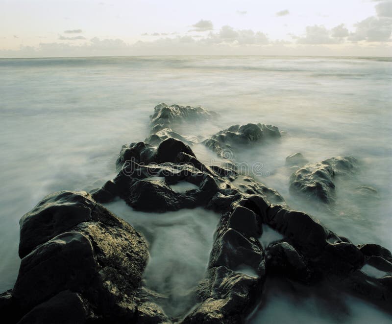 Mist among rocks at coast stock photo. Image of coastline - 30844942