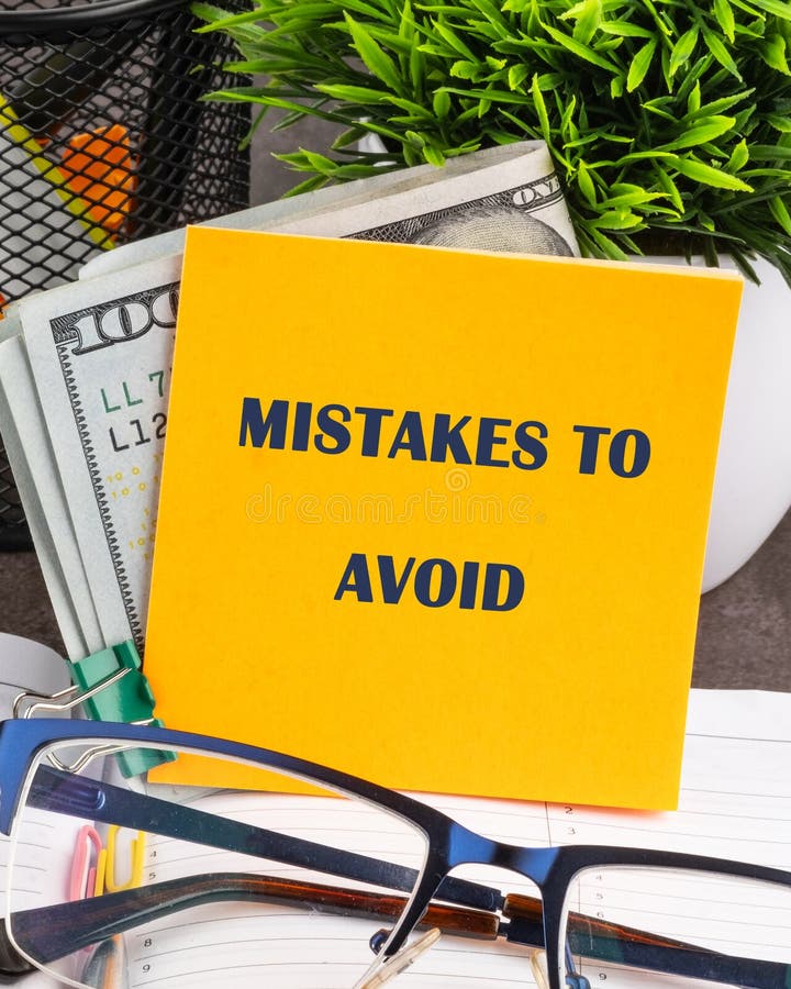 MISTAKES TO AVOID, Text on a Yellow Sticker on the Table Stock Photo ...