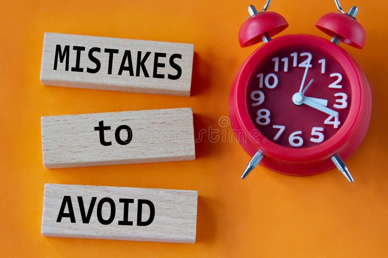 MISTAKES To AVOID - Words on Wooden Blocks on Orange Background with ...