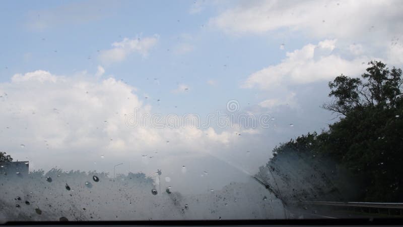 Misting Glass of Windshield with Raindrops and Blurred Background Stock ...