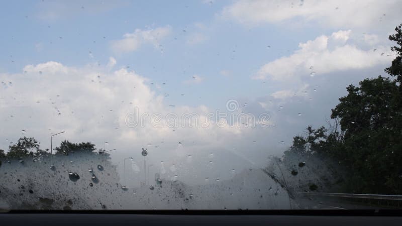 Misting Glass of Windshield with Raindrops and Blurred Background Stock ...
