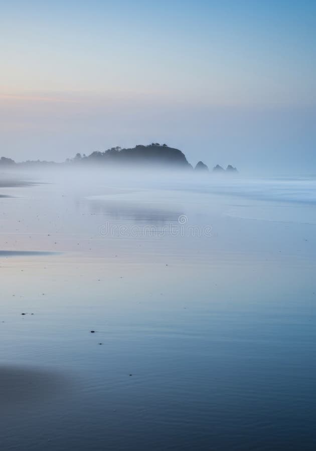 Misty Beach Sunrise: Calm Ocean, Blue Horizon Stock Illustration ...