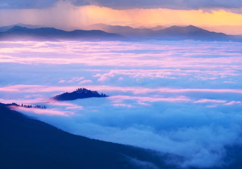 Misty Clouds in the Mountains at Sunrise Stock Image - Image of evening ...