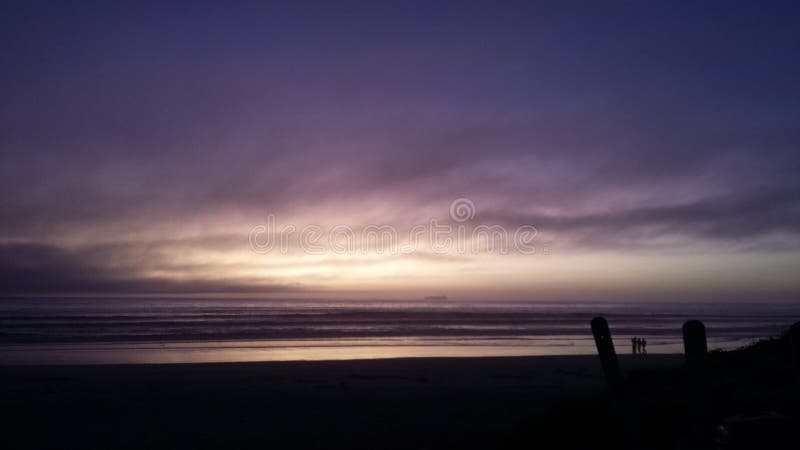 Misty sunset stock image. Image of sunset, beach, dusk - 53991009