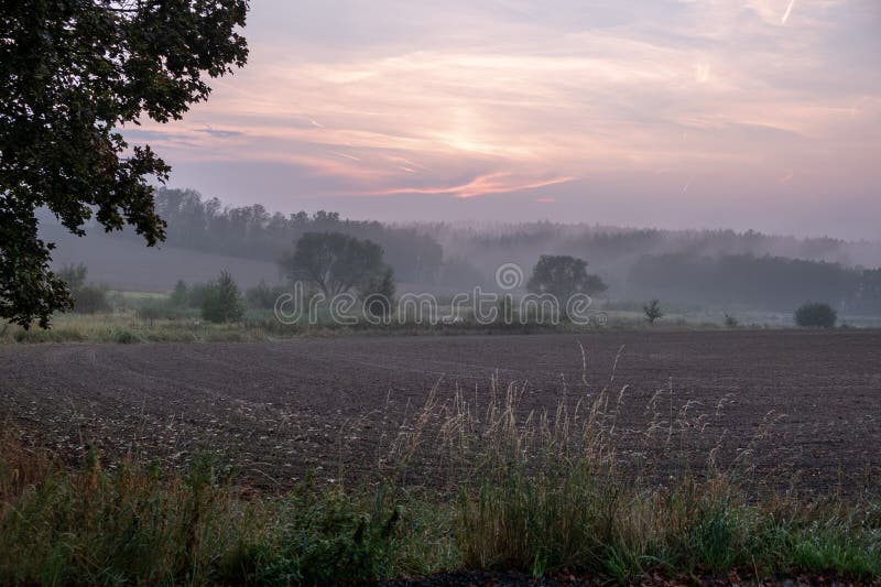 Misty Sunset, Plowed Field, Red Clouds, Landscape Stock Image - Image ...
