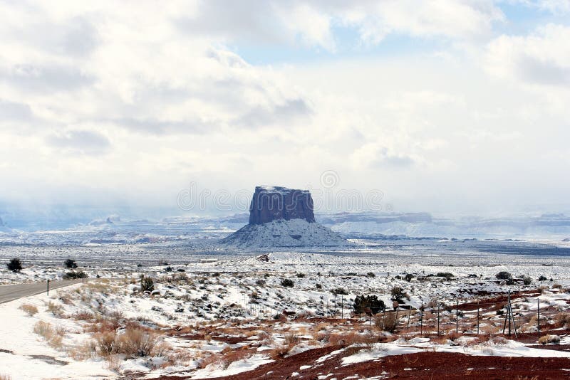 Mitchell Butte and the Desert after a Snowfall, Monument Valley Stock ...