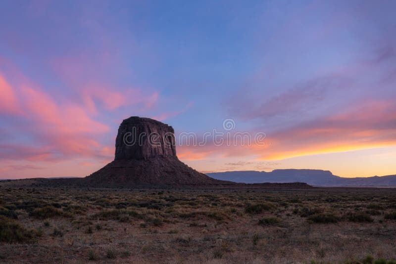 Mitchell Butte at Sunset in Monument Valley Stock Photo - Image of ...