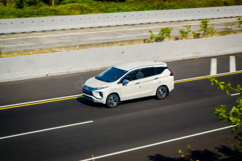 Mitsubishi Xpander Driving Fast on Trans Jawa Highway Editorial ...