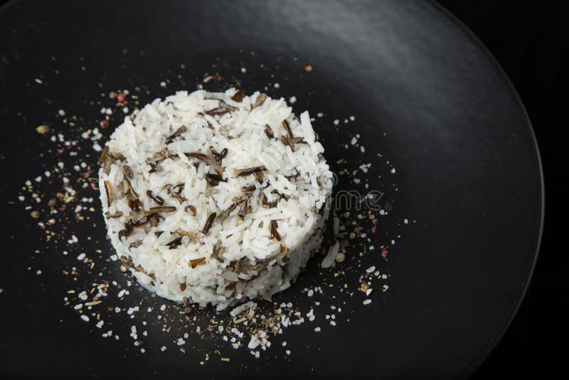 Mix of Black and White Rice on the Black Plate Stock Photo - Image of ...