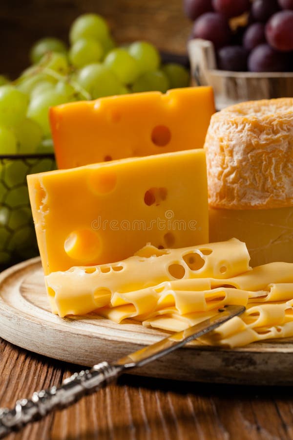 Mix cheese on wooden board stock image. Image of assorted - 245236713