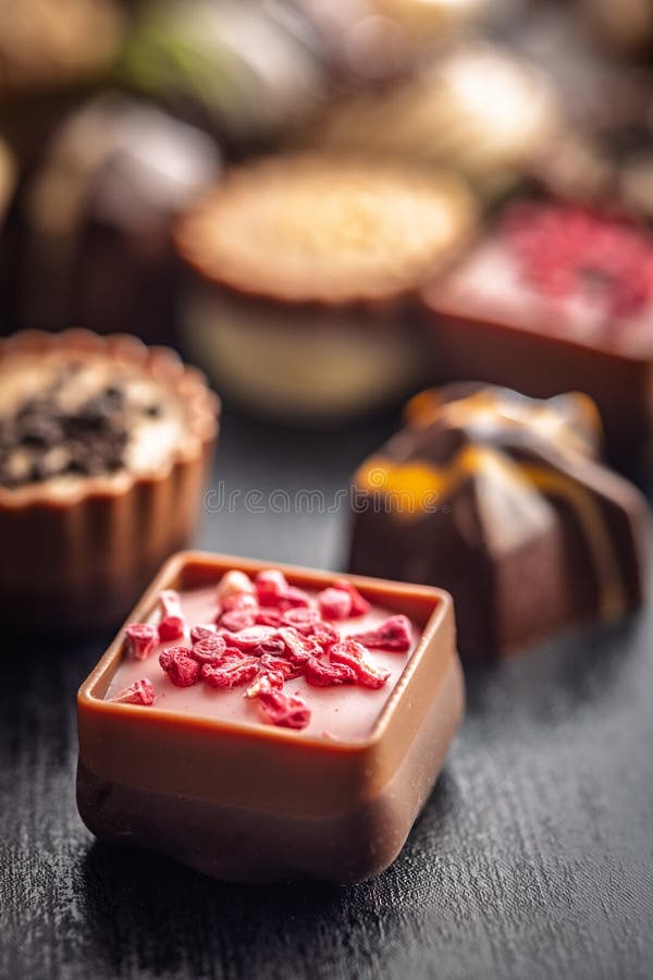 Mix of Chocolate Pralines on Black Table Stock Photo - Image of ...