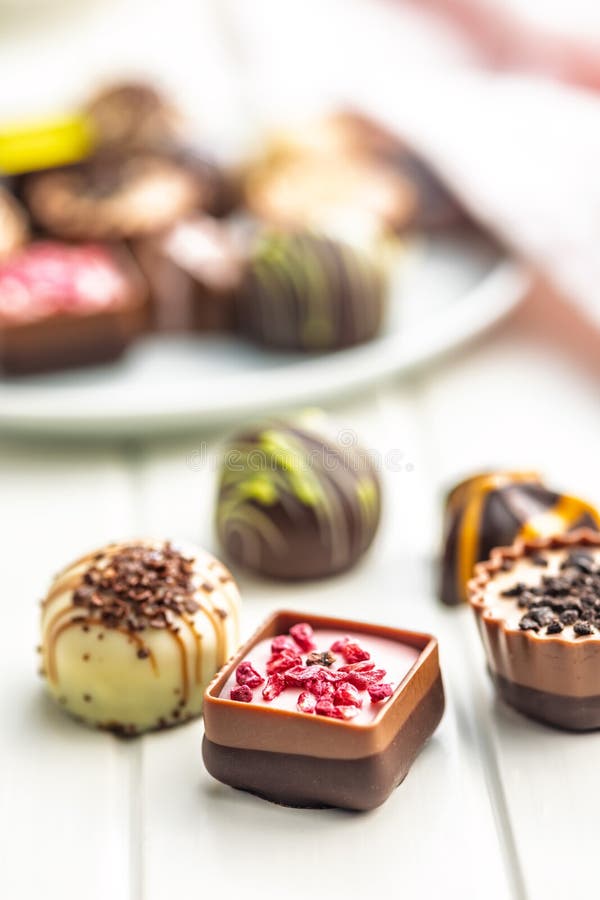 Mix of Chocolate Pralines on White Table Stock Image - Image of snack ...