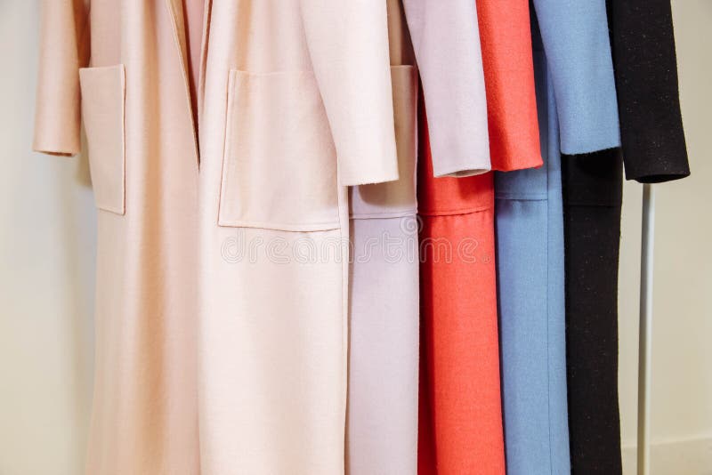 Mix Color Row of Female Coats on Hangers. Stock Photo - Image of ...