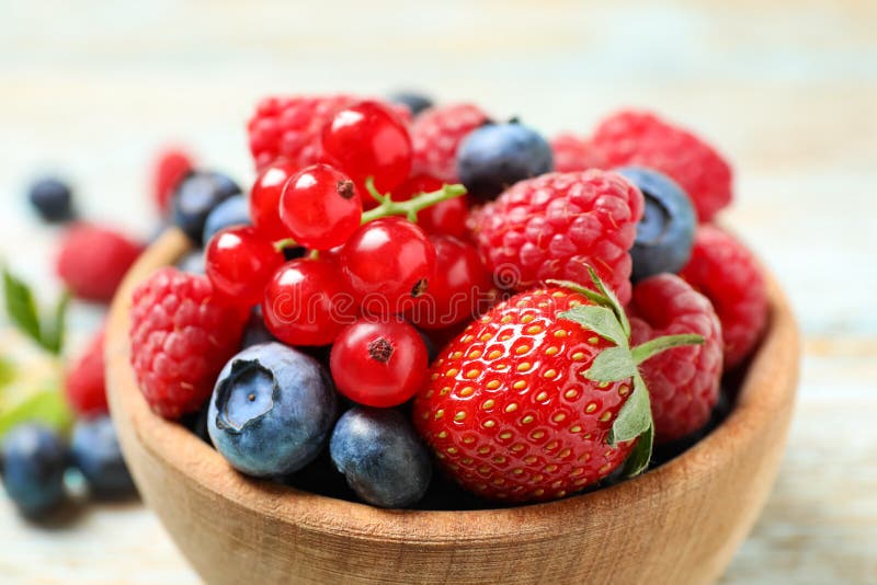 Mix of Different Fresh Berries in Bowl on Table Stock Photo - Image of ...