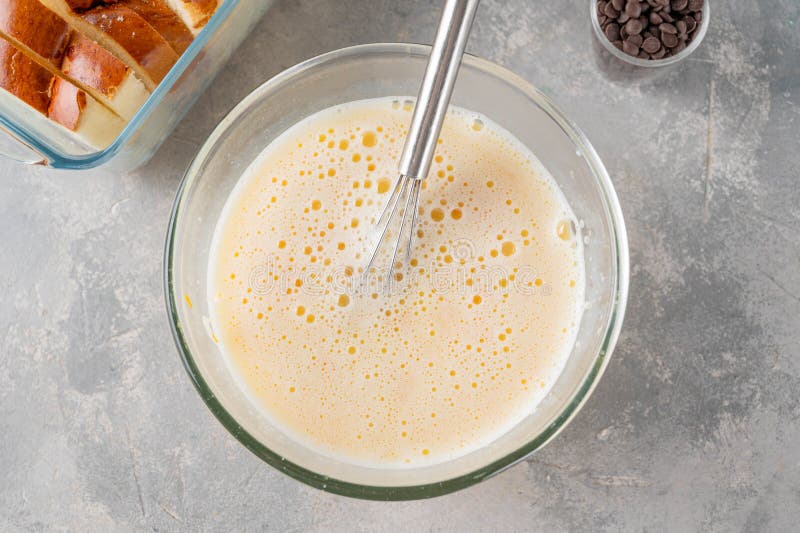 Mix of Eggs, Vanilla, Sugar and Orange Peel in a Bowl on a Gray ...