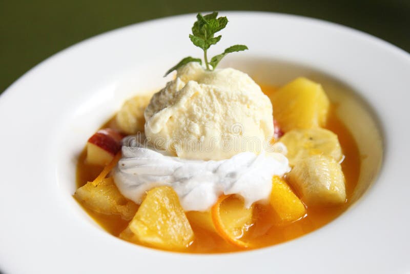 Mix Fruit Flambe Banana Orange and Apple with Ice Cream Stock Photo ...