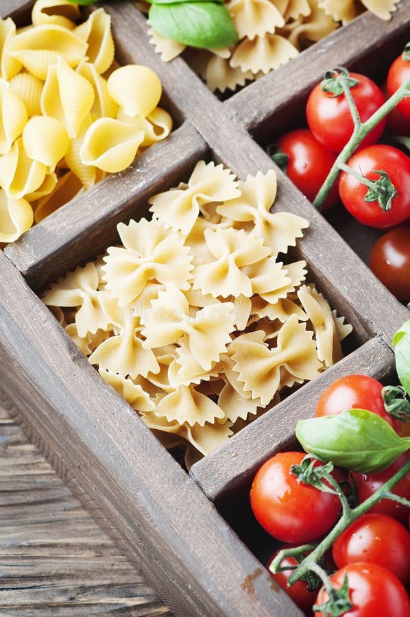 Mix of Italian Pasta, Tomato and Basil Stock Photo - Image of ...