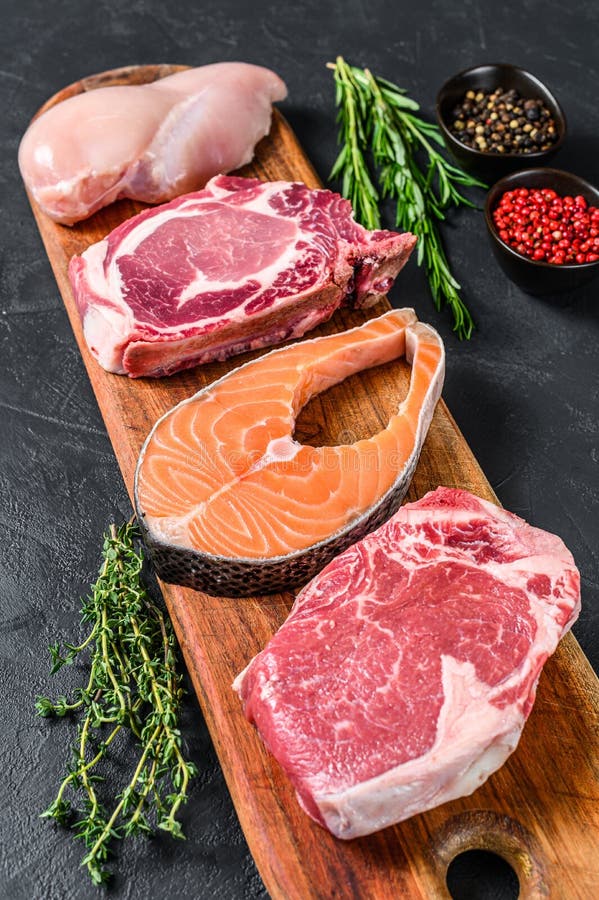 Mix of Meat Raw Steaks Salmon, Beef, Pork and Chicken. Black Background ...
