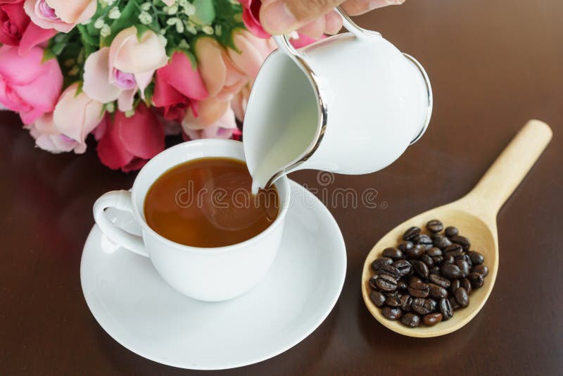 Mix Milk into a Cup of Coffee Stock Photo - Image of milk, brown: 59034950