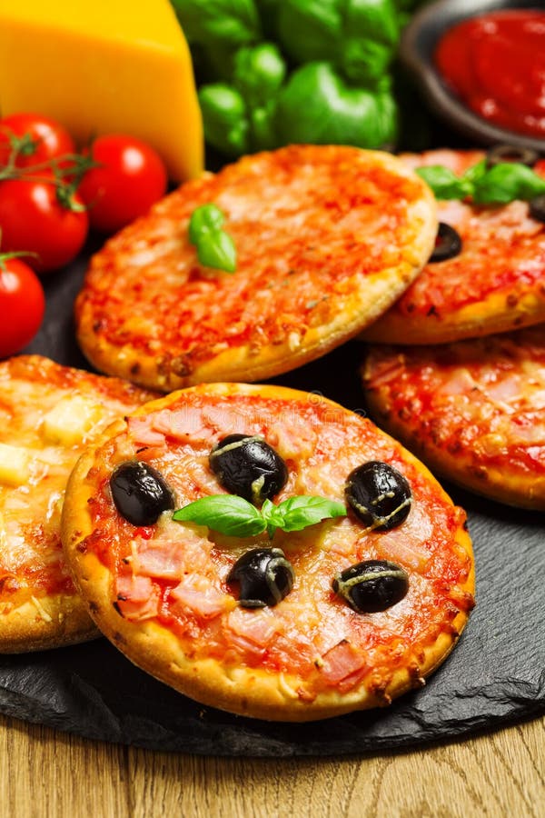 Mix of Mini Pizzas on a Stone Try Stock Image - Image of pepperoni ...