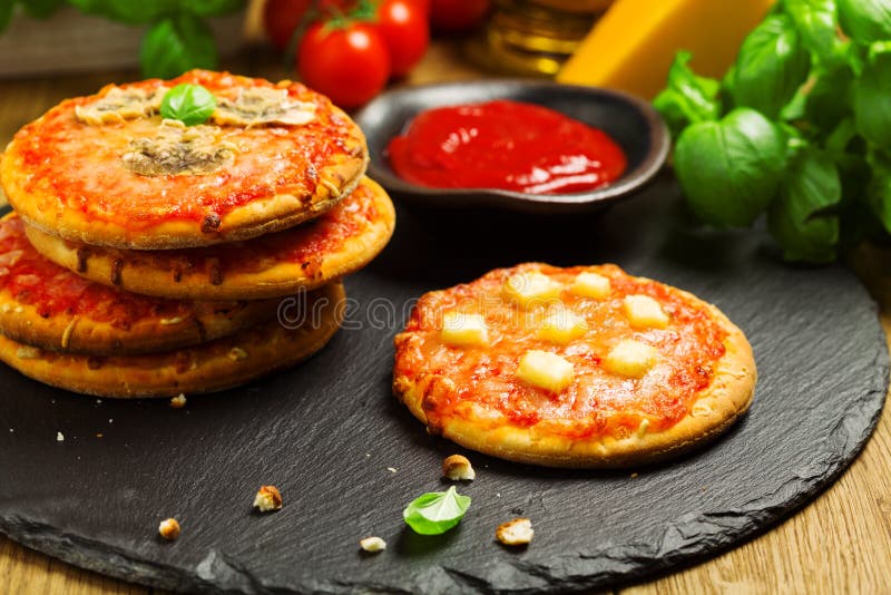 Mix of Mini Pizzas on a Stone Try Stock Photo - Image of little, stone ...