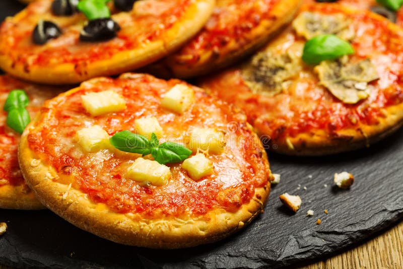 Mix of Mini Pizzas on a Stone Try Stock Photo - Image of american ...