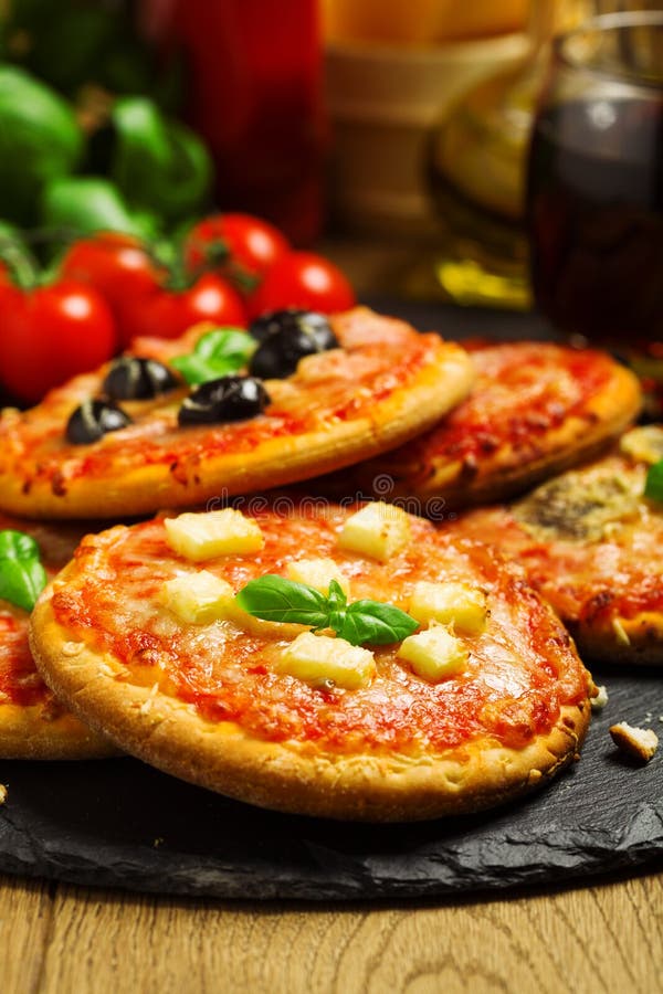 Mix of Mini Pizzas on a Stone Try Stock Image - Image of horizontal ...