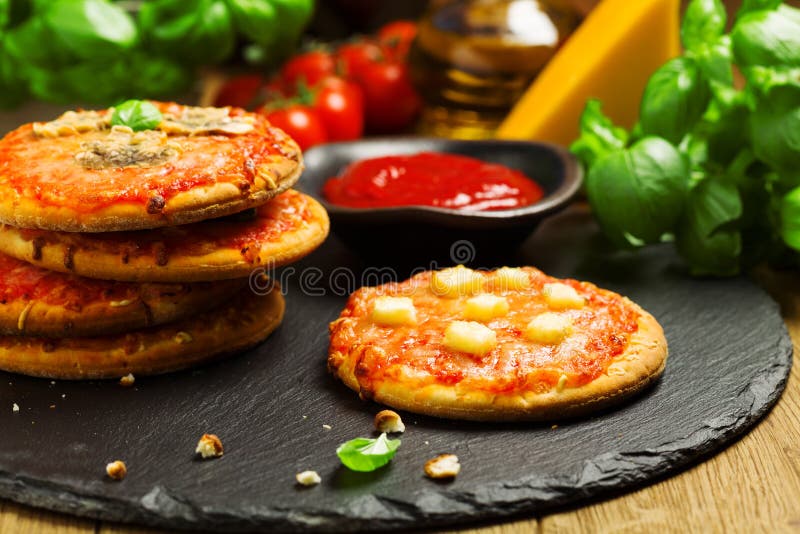 Mix of Mini Pizzas on a Stone Try Stock Photo - Image of black, meal ...