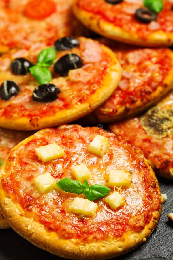 Mix of Mini Pizzas on a Stone Try Stock Image - Image of horizontal ...