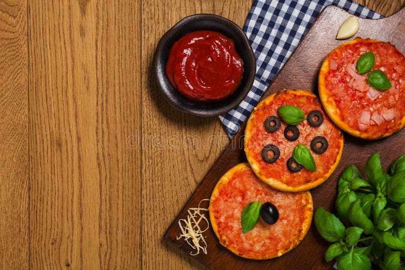 Mix of Mini Pizzas on Wooden Board Stock Photo - Image of mini, fast ...