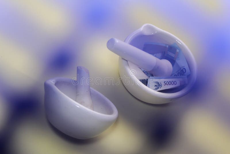 Mortir stamper and money stock image. Image of mortir - 109755397