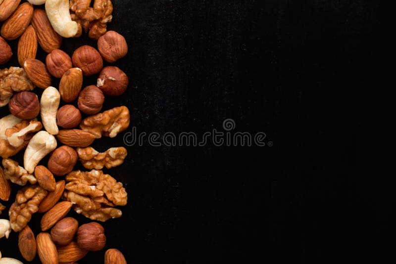 Mix of Nuts Frame on a Black Table Stock Photo - Image of organic, nuts ...