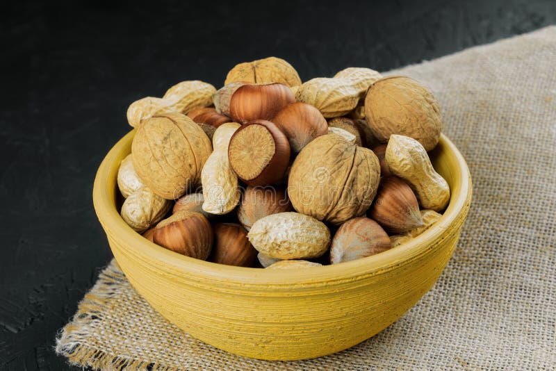 A Mix of Nuts in a Shell, in a Clay Plate Stock Photo - Image of retro ...