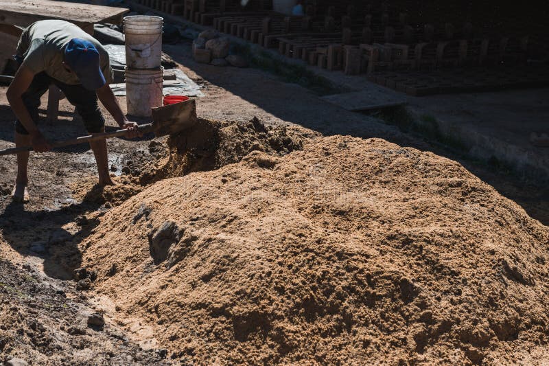 Mix of Sand, Mud, Water, Sawdust To Create a Paste for Making ...