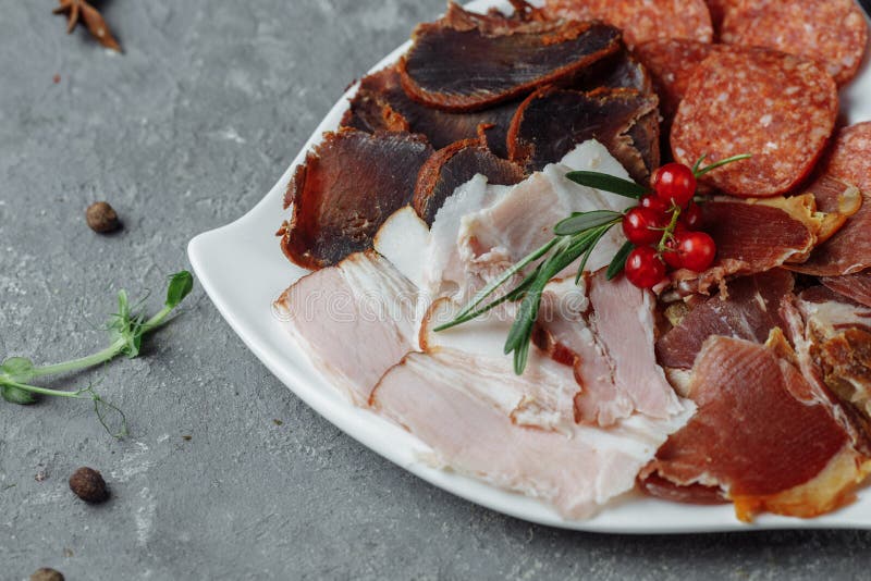 Mix of Sliced Meat on a White Plate Stock Photo - Image of prosciutto ...
