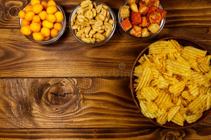 Mix of Snacks for Beer on Wooden Table Stock Photo - Image of heap ...