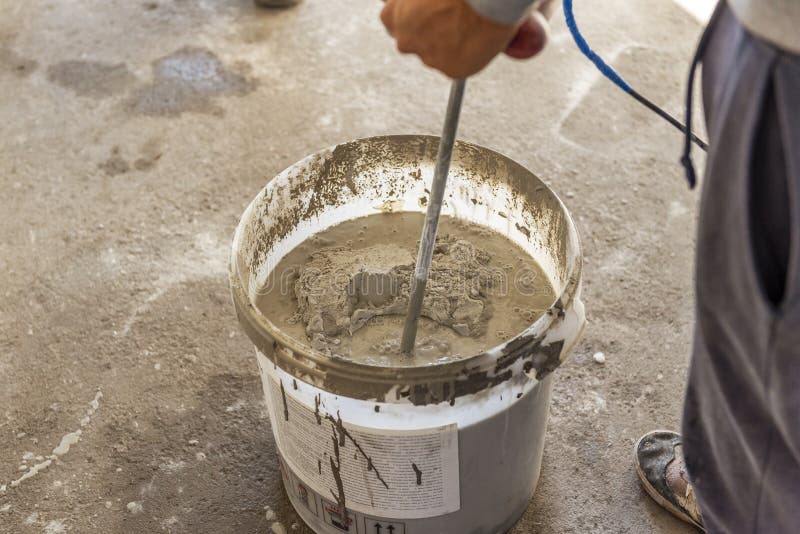 Mix the Solution with a Self-leveling Floor in a Bucket Stock Photo ...