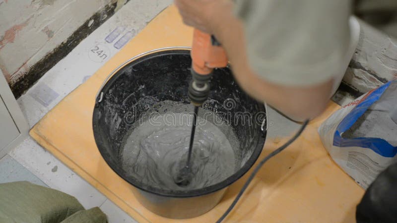 Mix the Tile Adhesive with an Electric Hand Mixer Stock Video - Video ...