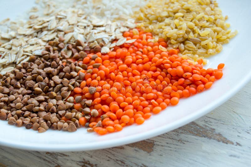 Mix of Various Cereals on White Plate Stock Photo - Image of closeup ...