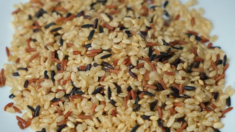 Mix of White, Red and Black Rice Pouring Close Up Stock Video - Video ...
