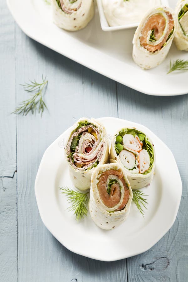 Mix of Wraps with Ham, Chicken, Salmon and Crab Served Stock Image ...